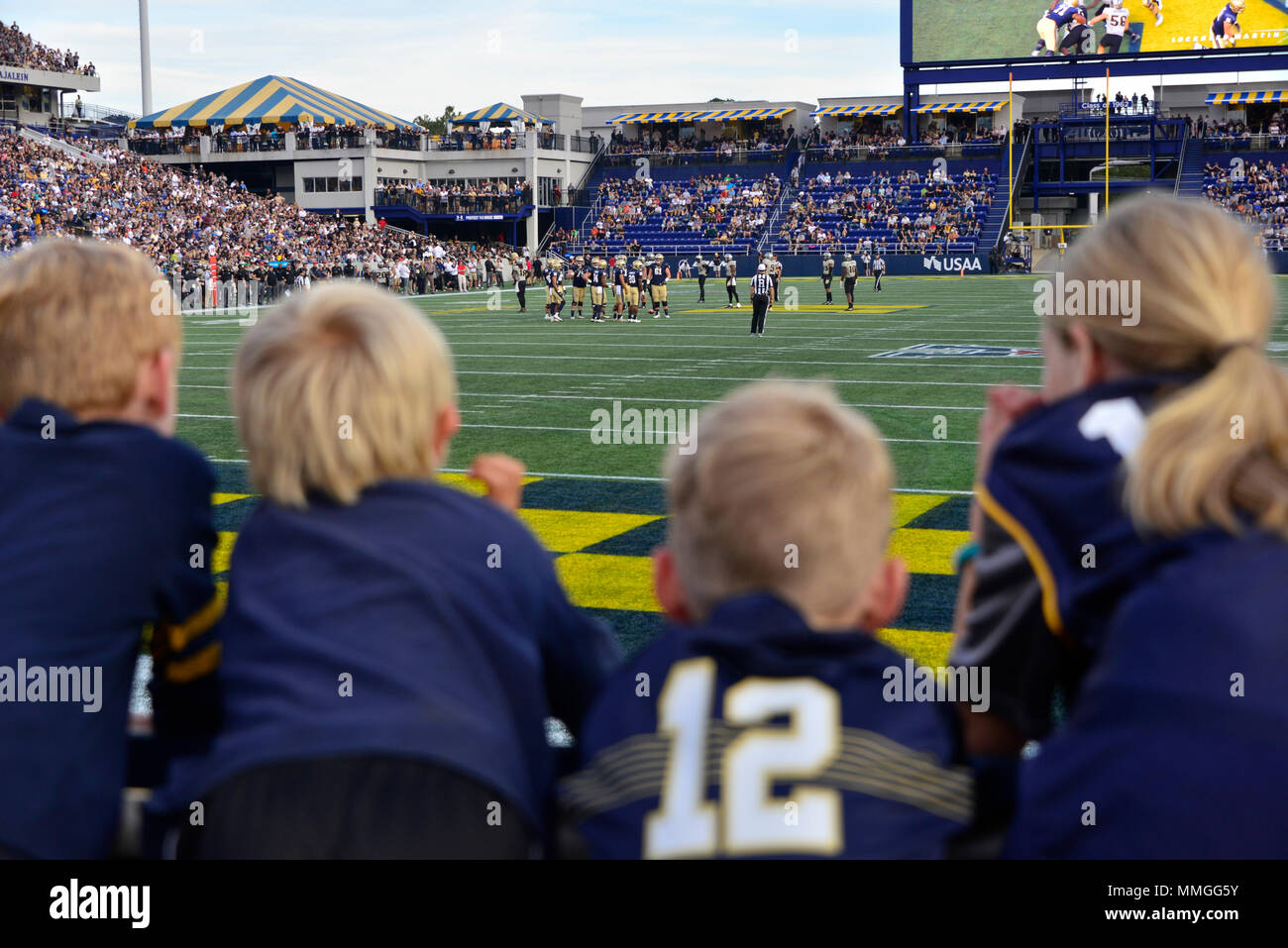 Fans of the U.S. Naval Academy football team, the Midshipmen, cheer at ...