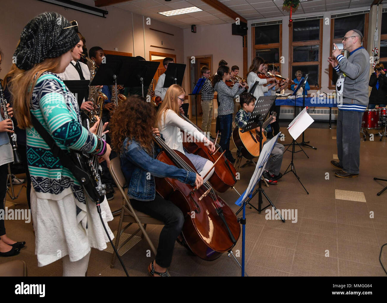 Howard Worona, Hanscom Middle School music teacher, leads a musical ...