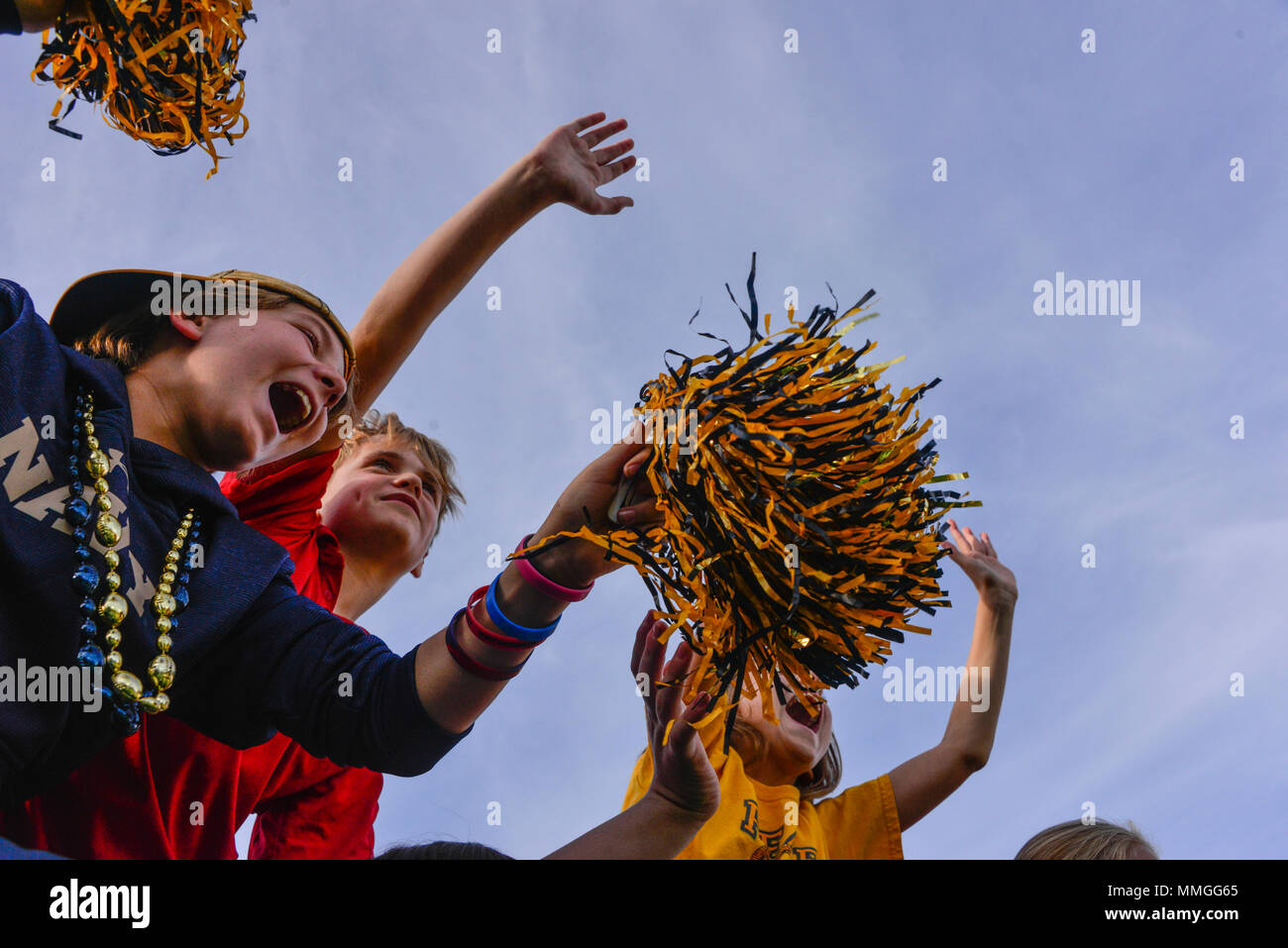 Fans of the U.S. Naval Academy football team, the Midshipmen, cheer at ...