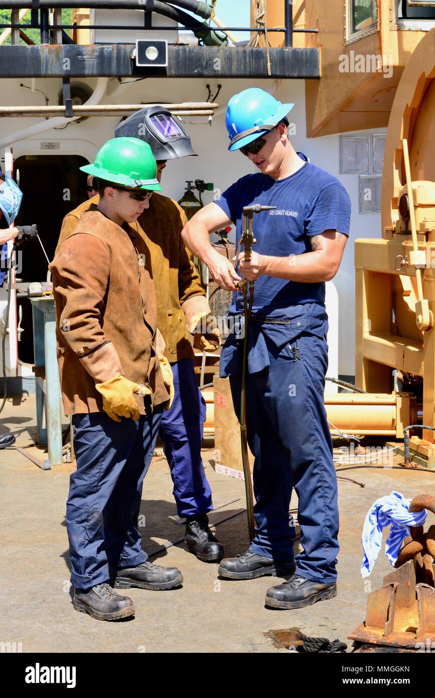 The crew of the USCGC Walnut (WLB 205) prepares shots of chain while ...