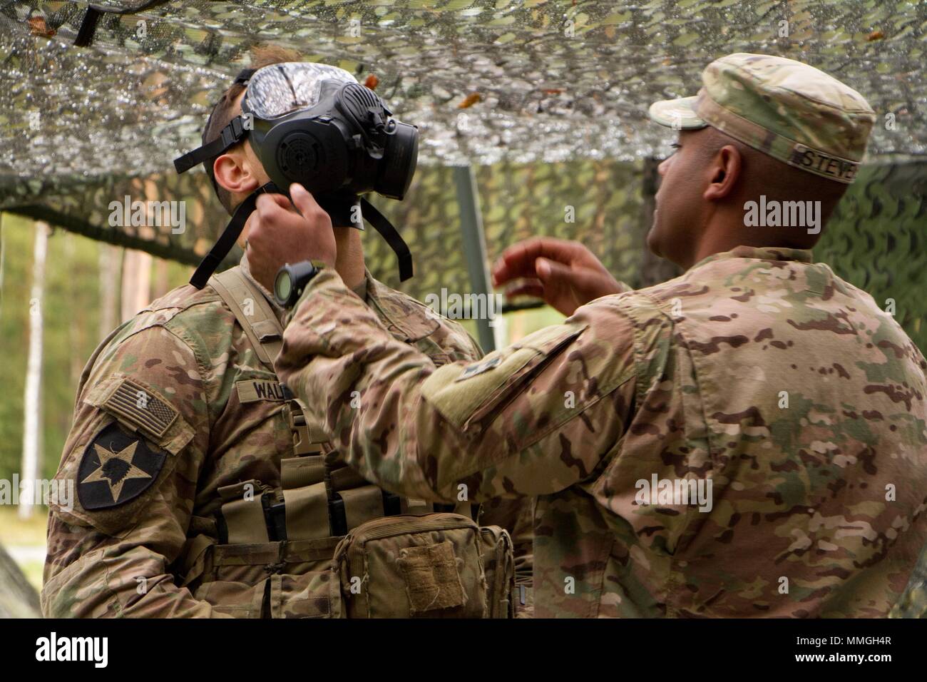 A candidate from 2d Cavalry Regiment is tested on his ability to don ...