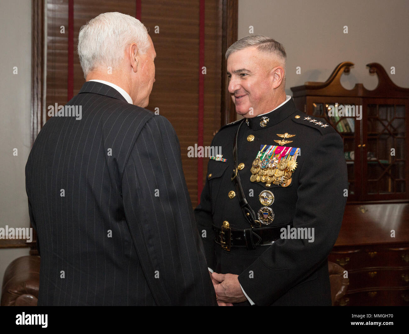 Vice President Mike Pence, right, speaks with the Assistant Commandant ...