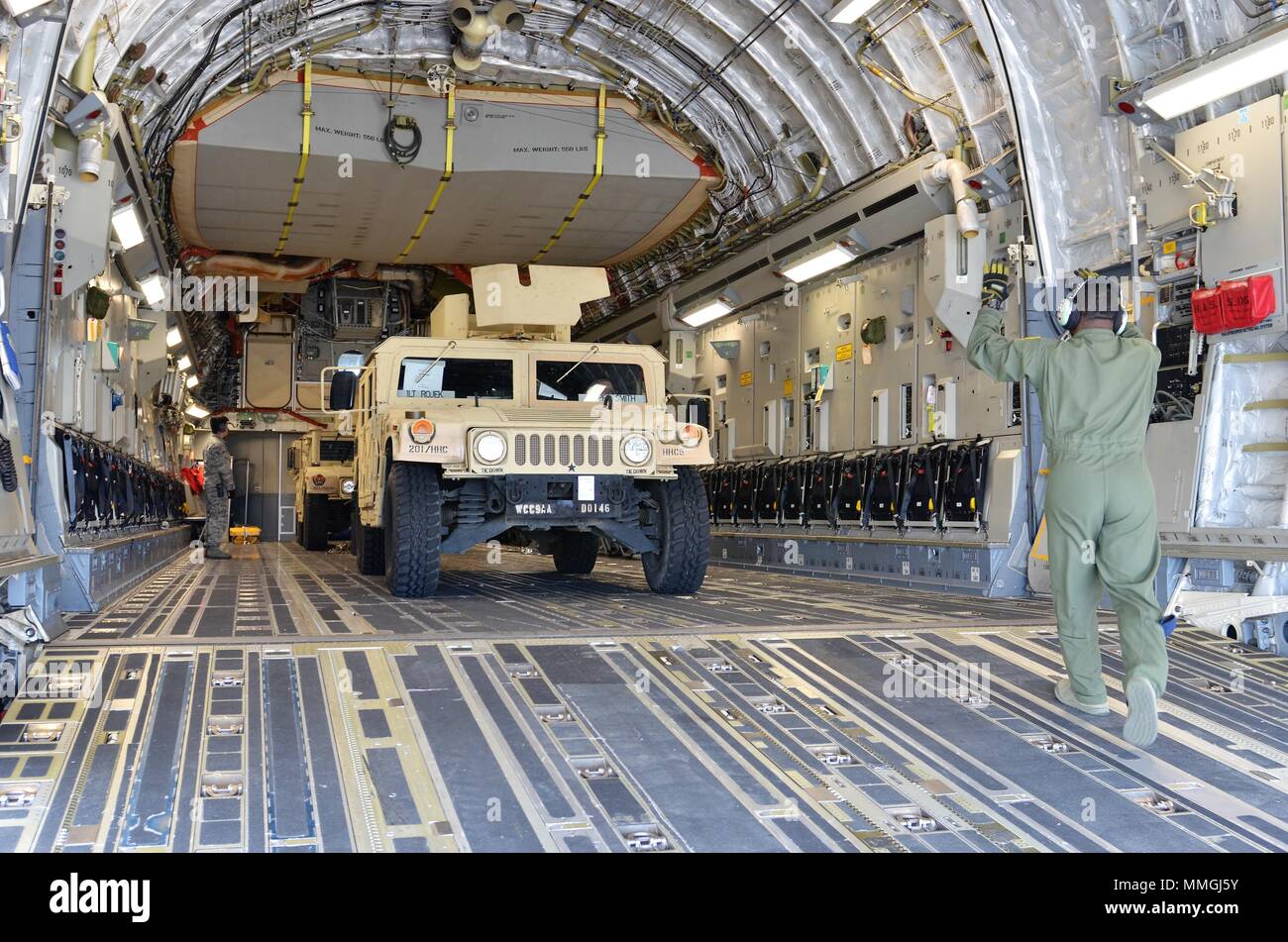 An Air Force loadmaster from the 62nd Airlift Wing at Joint Base Lewis ...