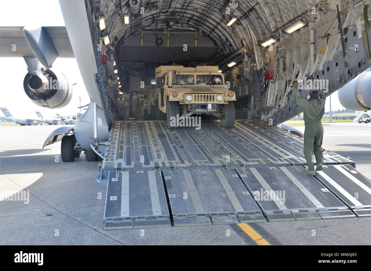 An Air Force loadmaster from the at Joint Base Lewis-McChord, Wash ...