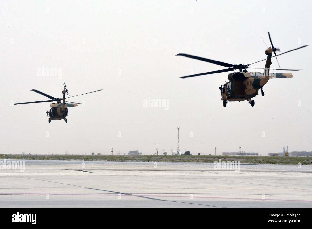 KANDAHAR AIRFIELD (May 8, 2018) -- Two UH-60 Black Hawks, one operated ...