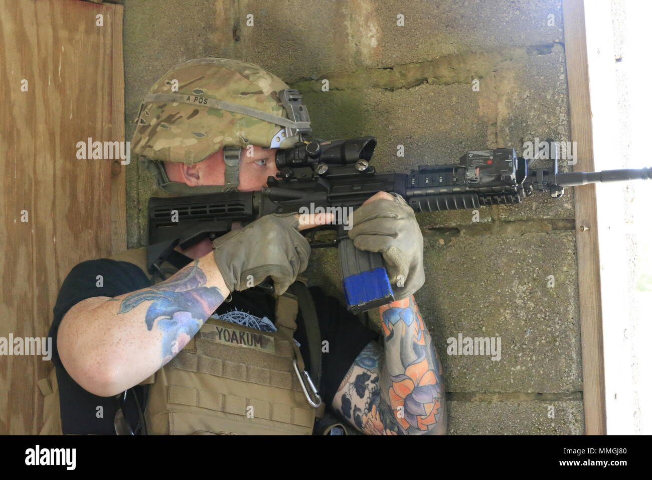 U.S. Army Pfc. Tyler Yoakum, 1st Battalion, 4th Infantry Regiment, acts ...