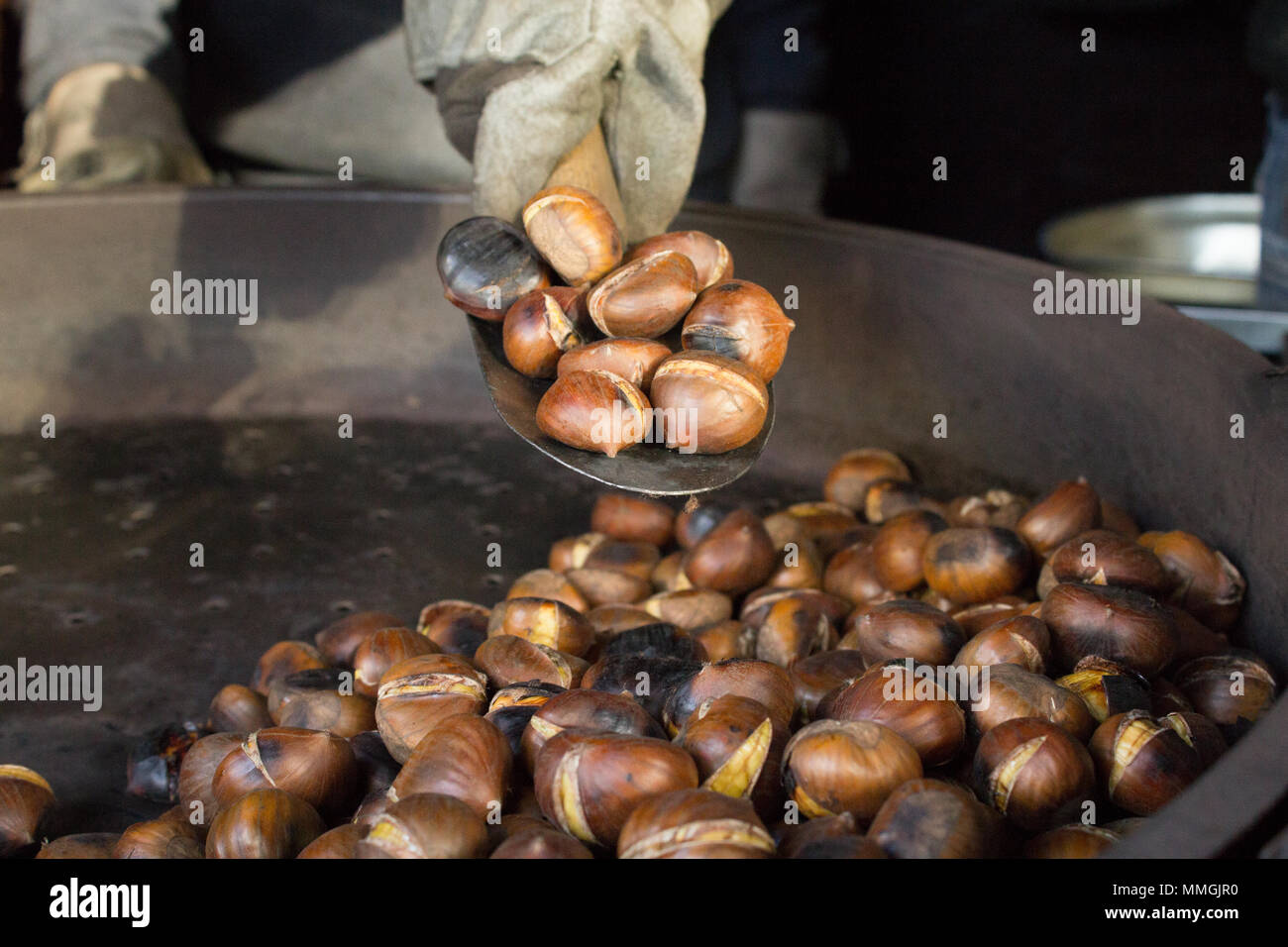 Market seller roasting chestnuts hi-res stock photography and images ...