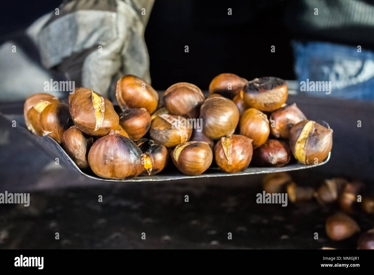 Market seller roasting chestnuts hi-res stock photography and images ...