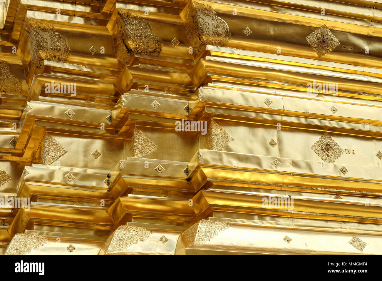 The gold stucco design of native thai style on the Wall Stock Photo - Alamy