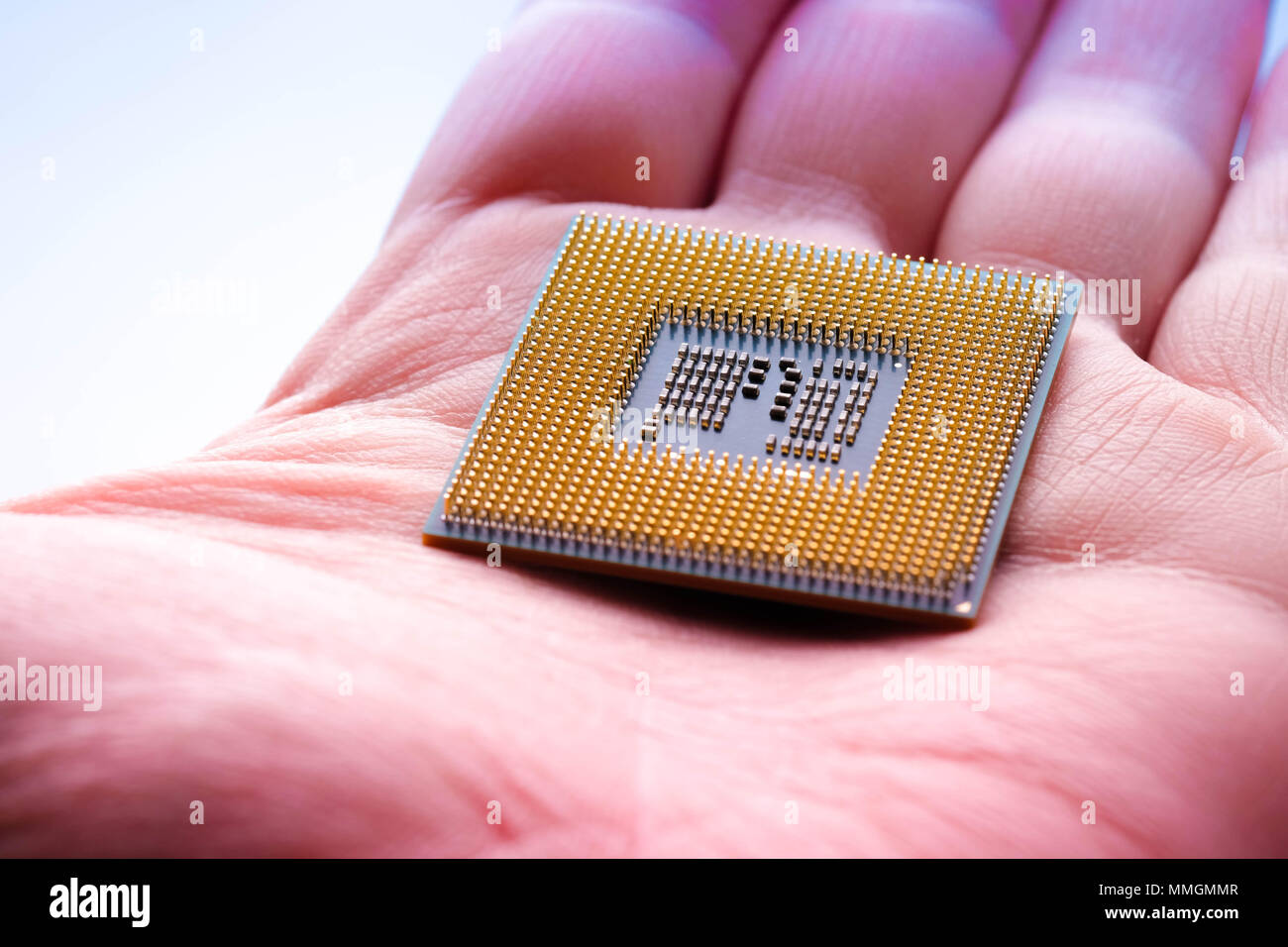 technology cyber electronic concept. cpu microprocessor chip in hand ...