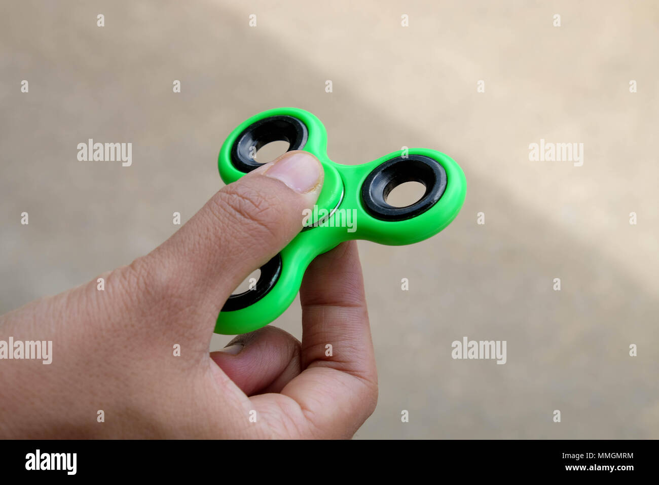 Fidget Spinner speed Spin in hands Stock Photo - Alamy