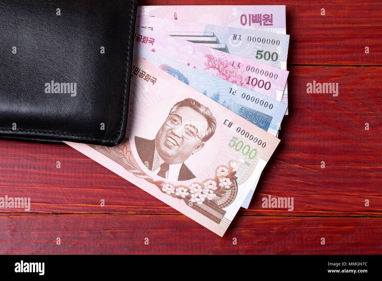 North Korean money in the black wallet Stock Photo - Alamy