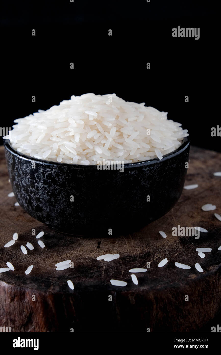 White rice in a cup the staple food of Asians Stock Photo - Alamy