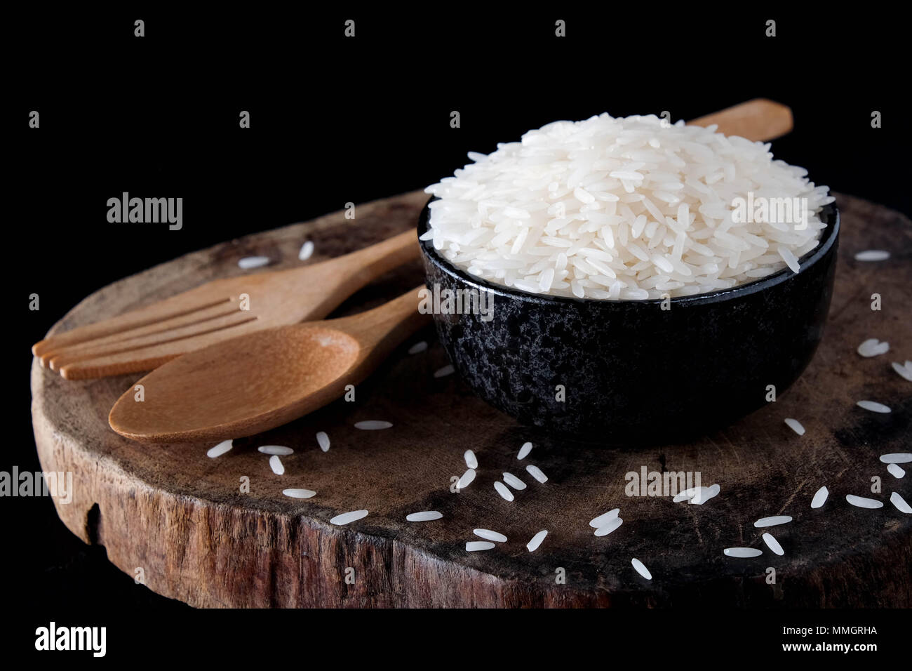 White rice in a cup the staple food of Asians Stock Photo - Alamy