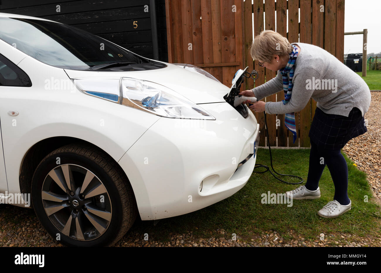 Plug in electric car hi-res stock photography and images - Alamy