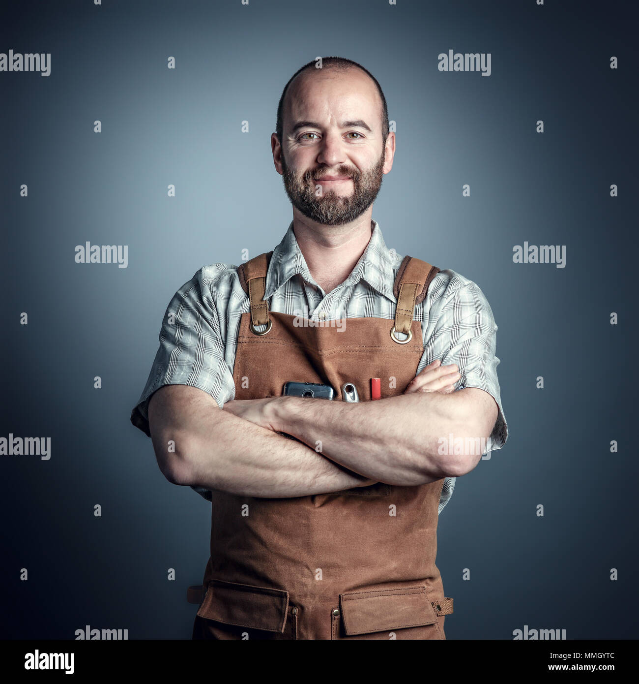 portrait of confident wood worker crossed arms, studio shot Stock Photo ...