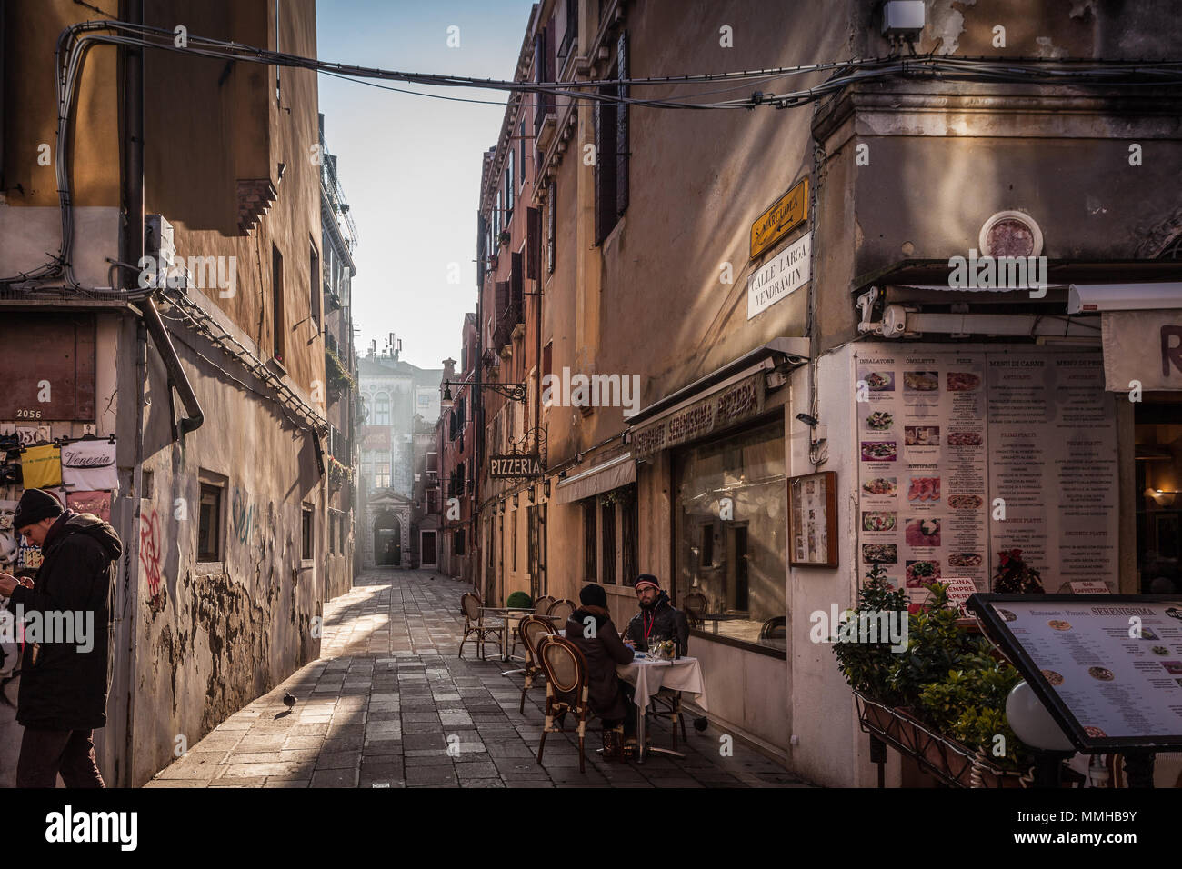 VENICE, ITALY - JANUARY 02 2018: traditional venetian street with small ...