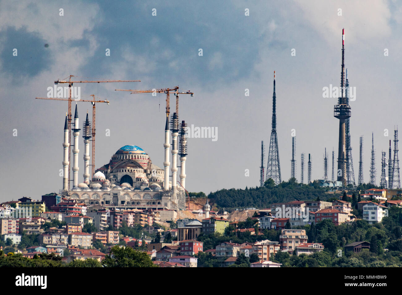 Construction cranes can be seen as mosque is being restored in Istanbul ...