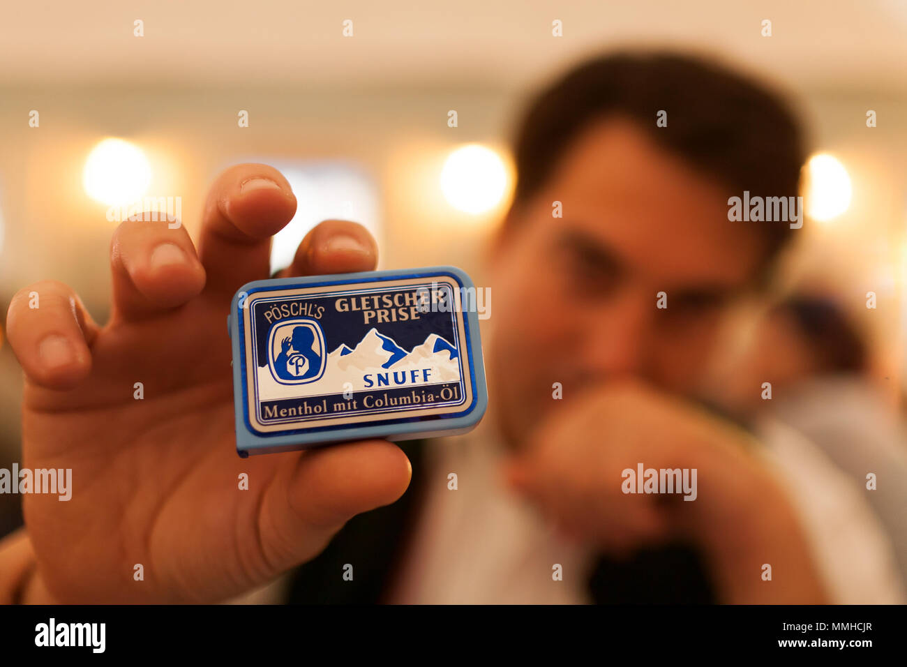Man sniffing Poeschl's Gletscherprise snuff in Bavaria Stock Photo - Alamy