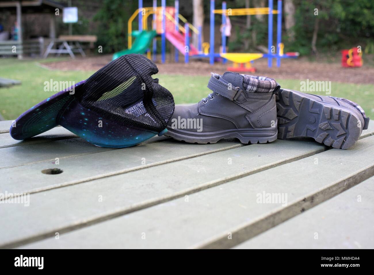 Boy removing boots hi-res stock photography and images - Alamy