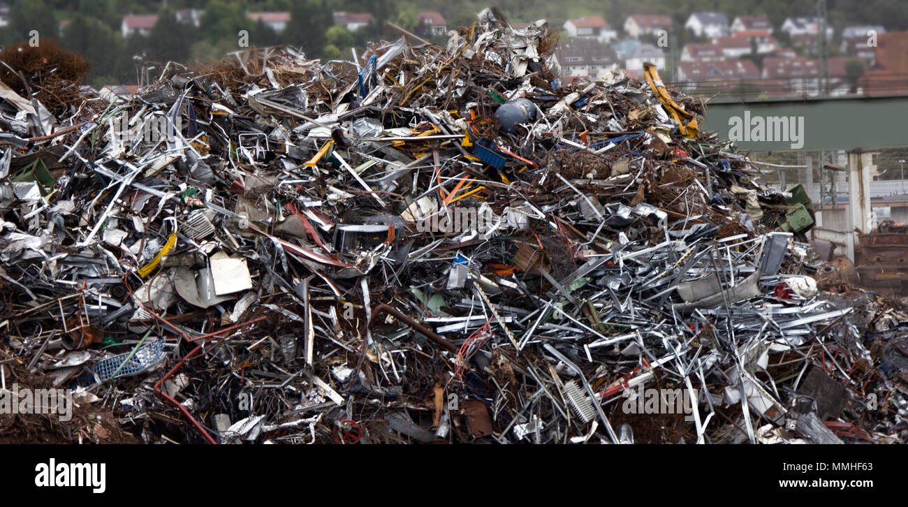 Mountain of scrap metal - predominantly ferrous metals. Village in ...