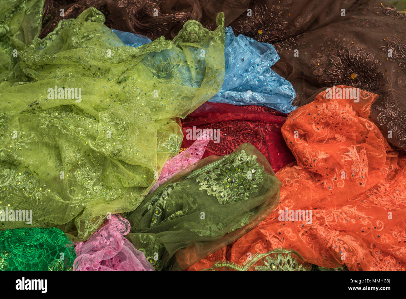 Clothes and textiles for sale in the textile markets of old town Duba ...