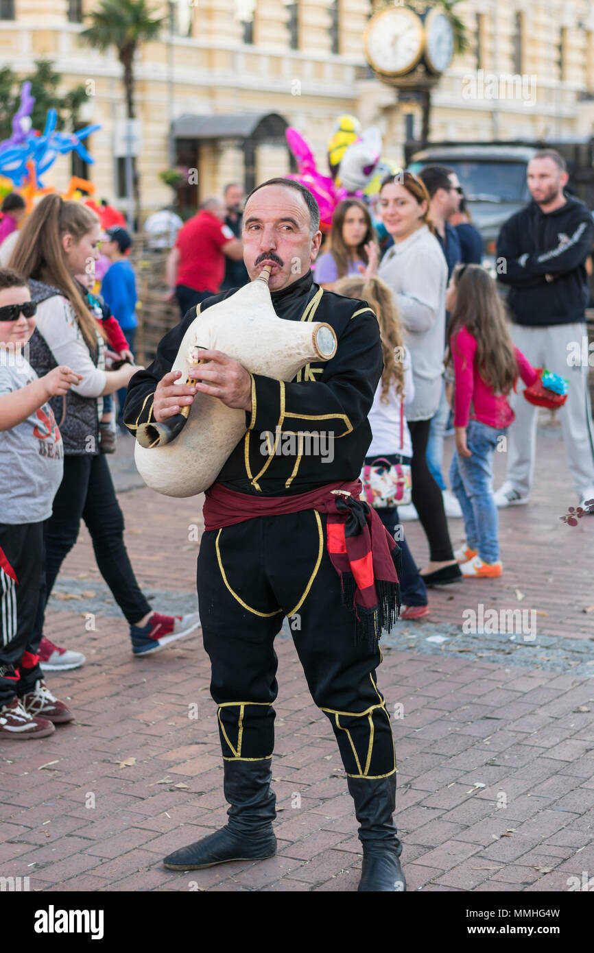 A man in national Adzharian clothes plays on the Georgian national ...