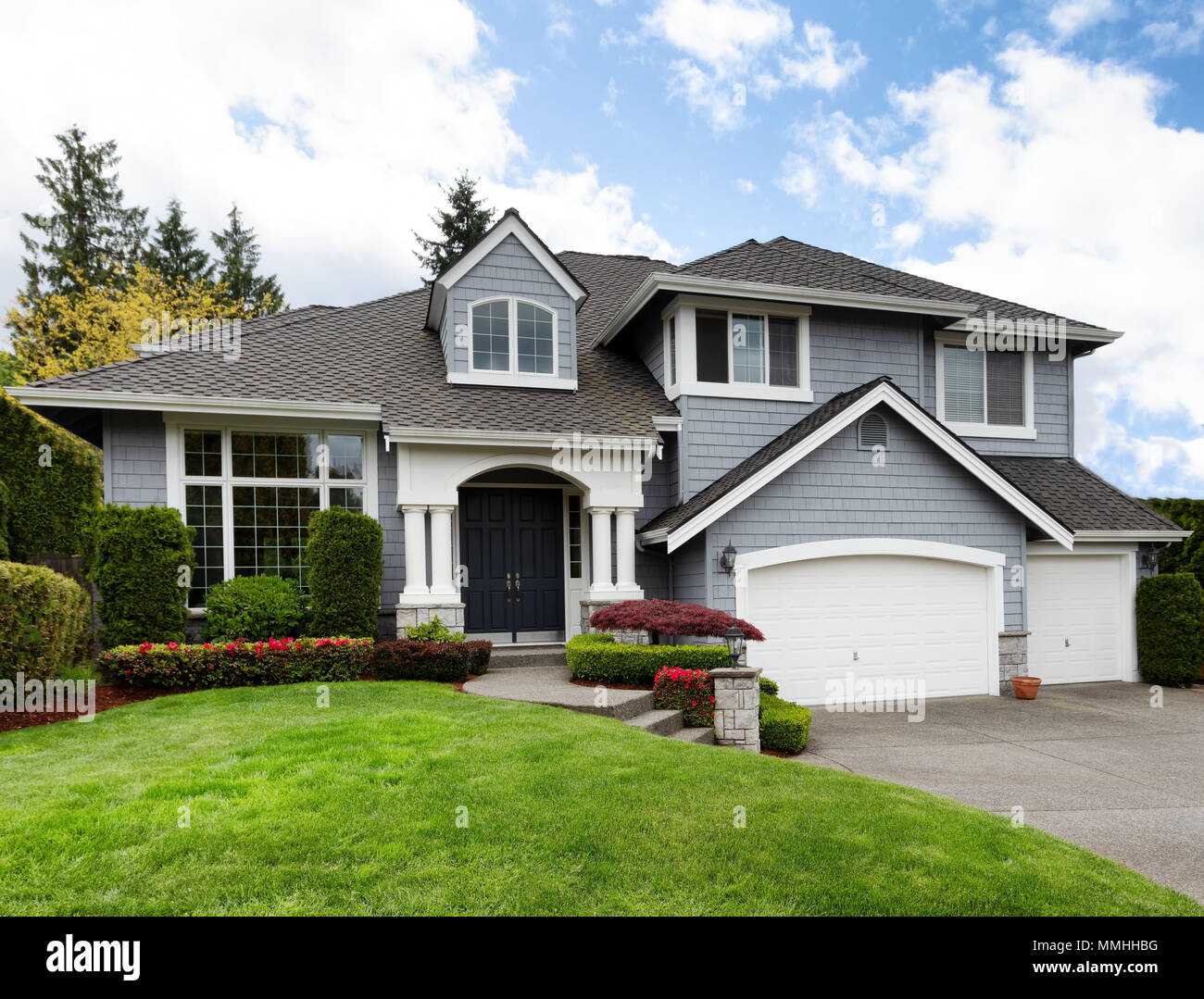 Clean home with healthy front yard during late spring season Stock ...