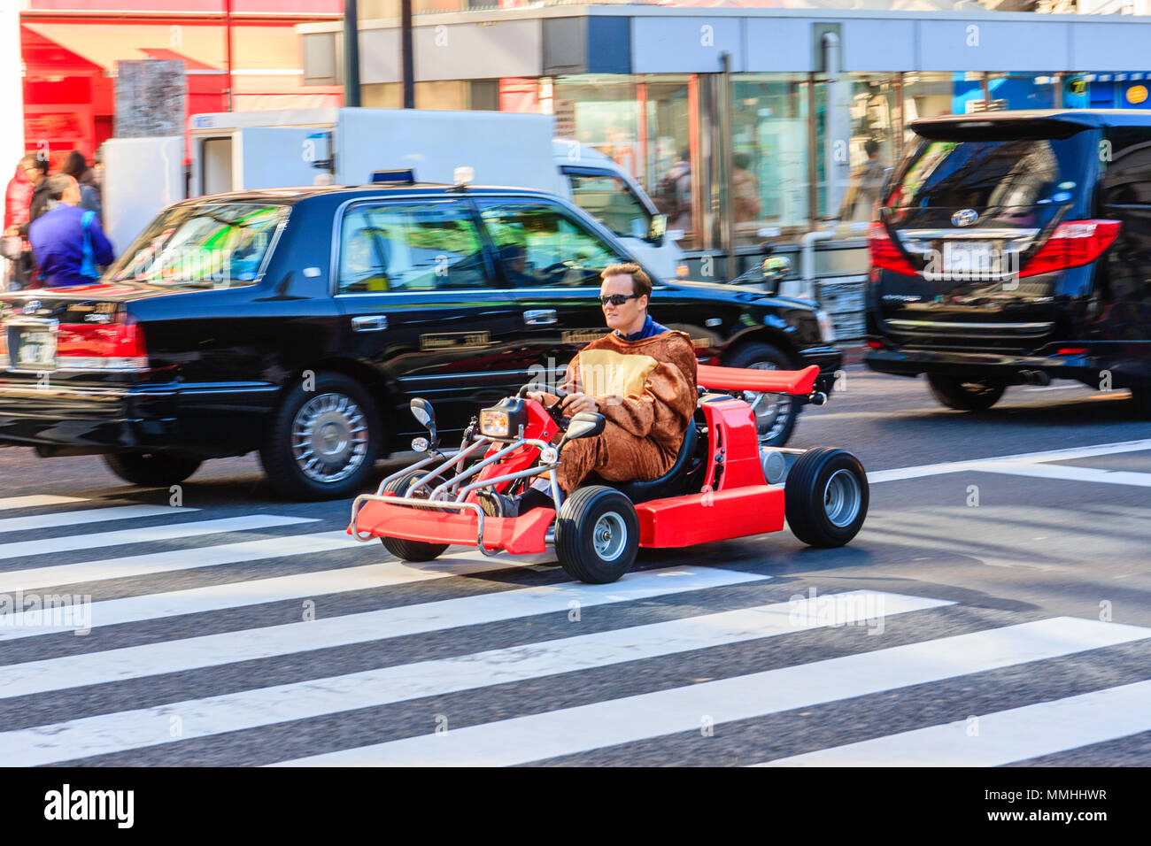 Tokyo, Shibuya crossing. Popular tourist activity, driving MariCar ...