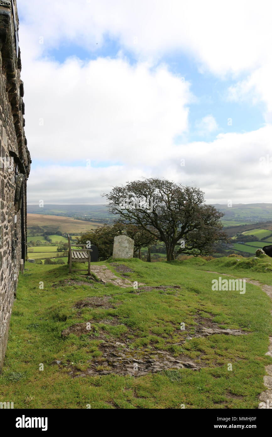 View from Brentor Church, Cornwall showing side of Church, bench and ...