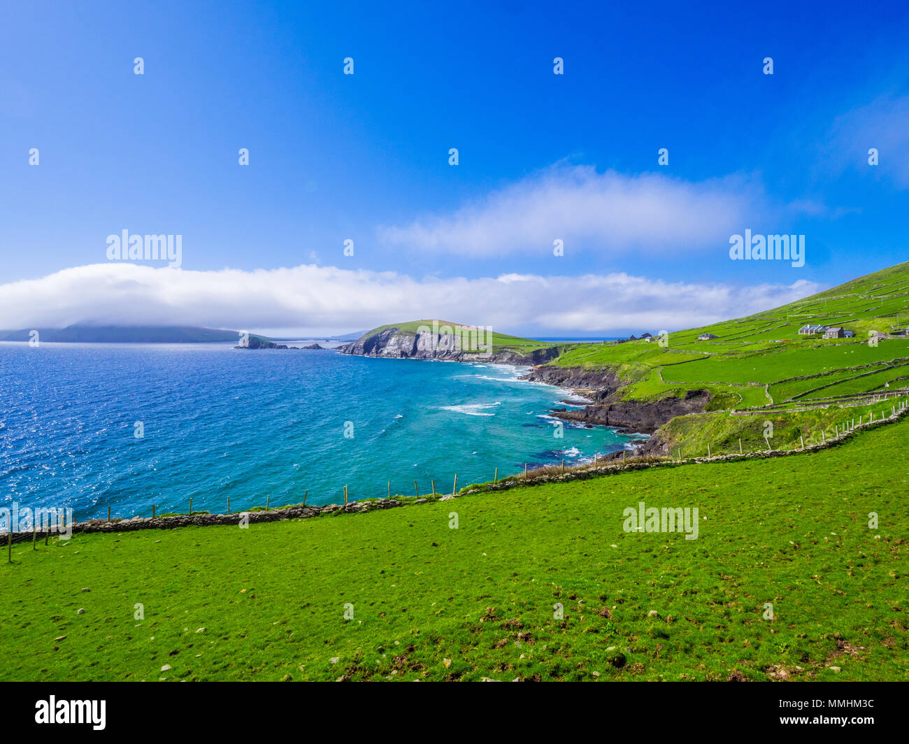 Green hills and blue Ocean water - typical for Ireland west coast Stock ...