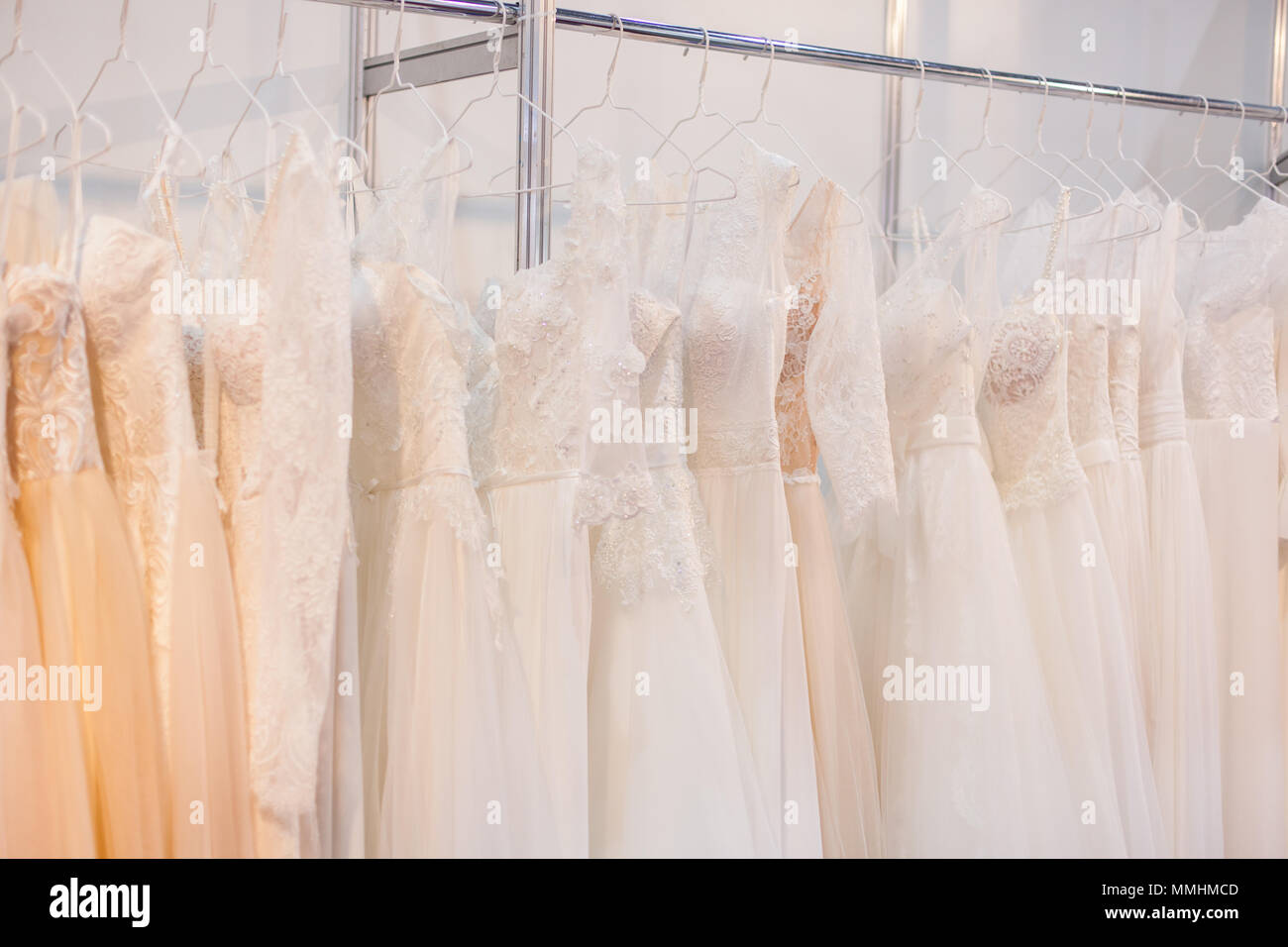 Rack many beautiful wedding dresses hi-res stock photography and images ...