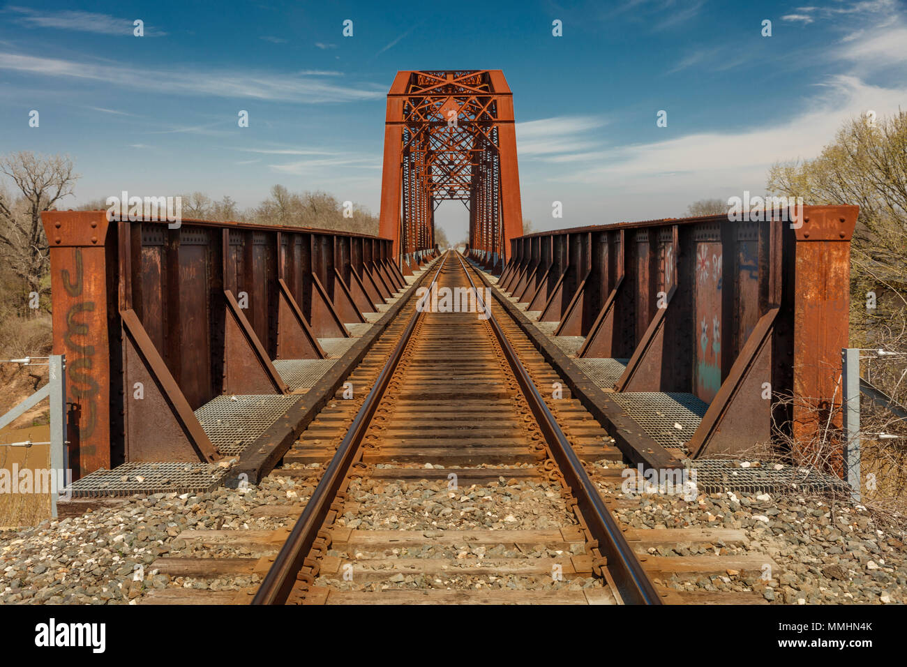 Iron Railroad Bridge over water, Texas Stock Photo - Alamy