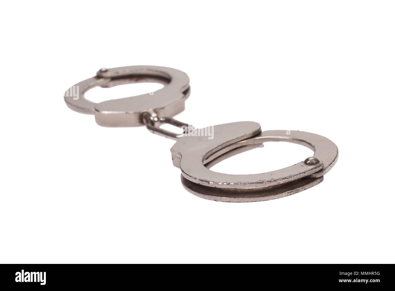 handcuffs isolated on white background Stock Photo - Alamy
