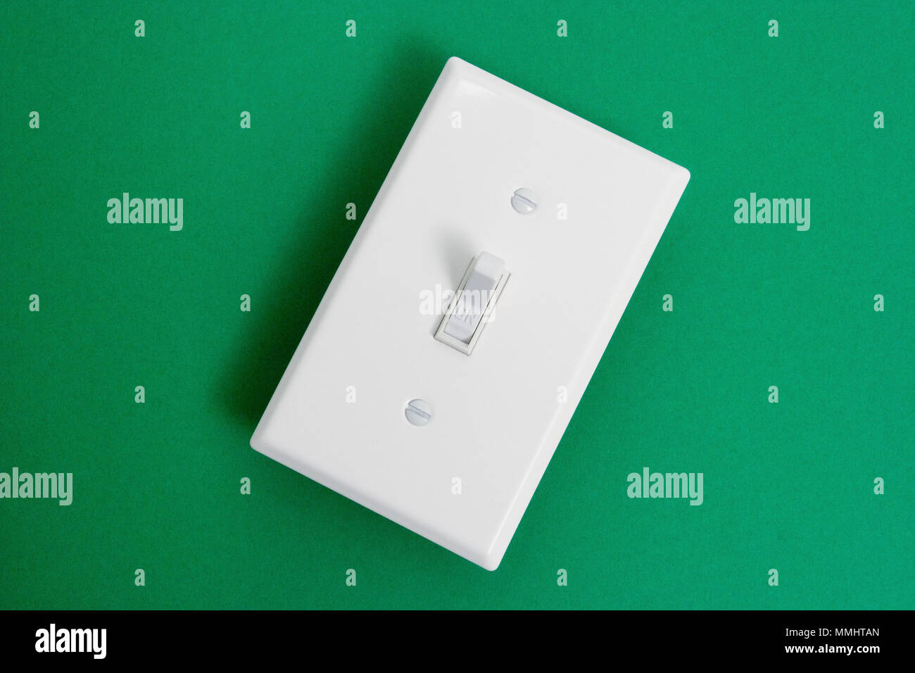 Eco friendly, renewable power, white electric switch on green ...