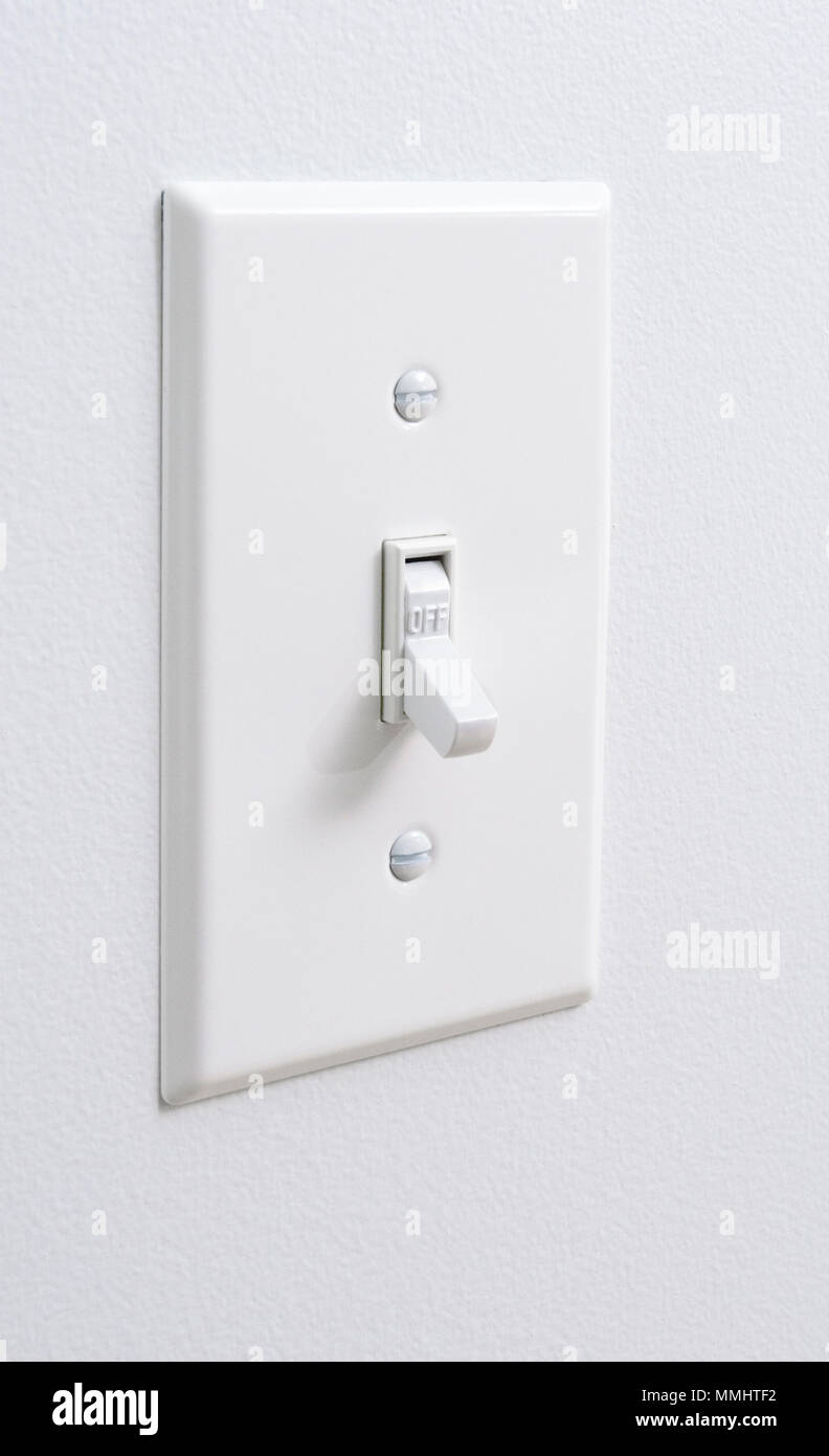 Eco friendly, renewable power, white electric switch on white wall ...