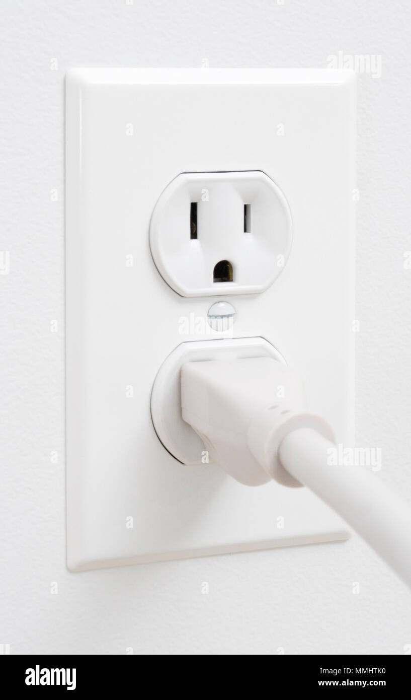 Eco friendly, renewable power, white electrical outlet on white wall ...