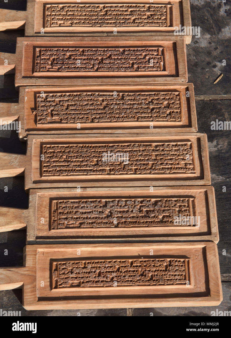 Drying Tibetan woodblock prints at the holy Bakong Scripture Printing ...