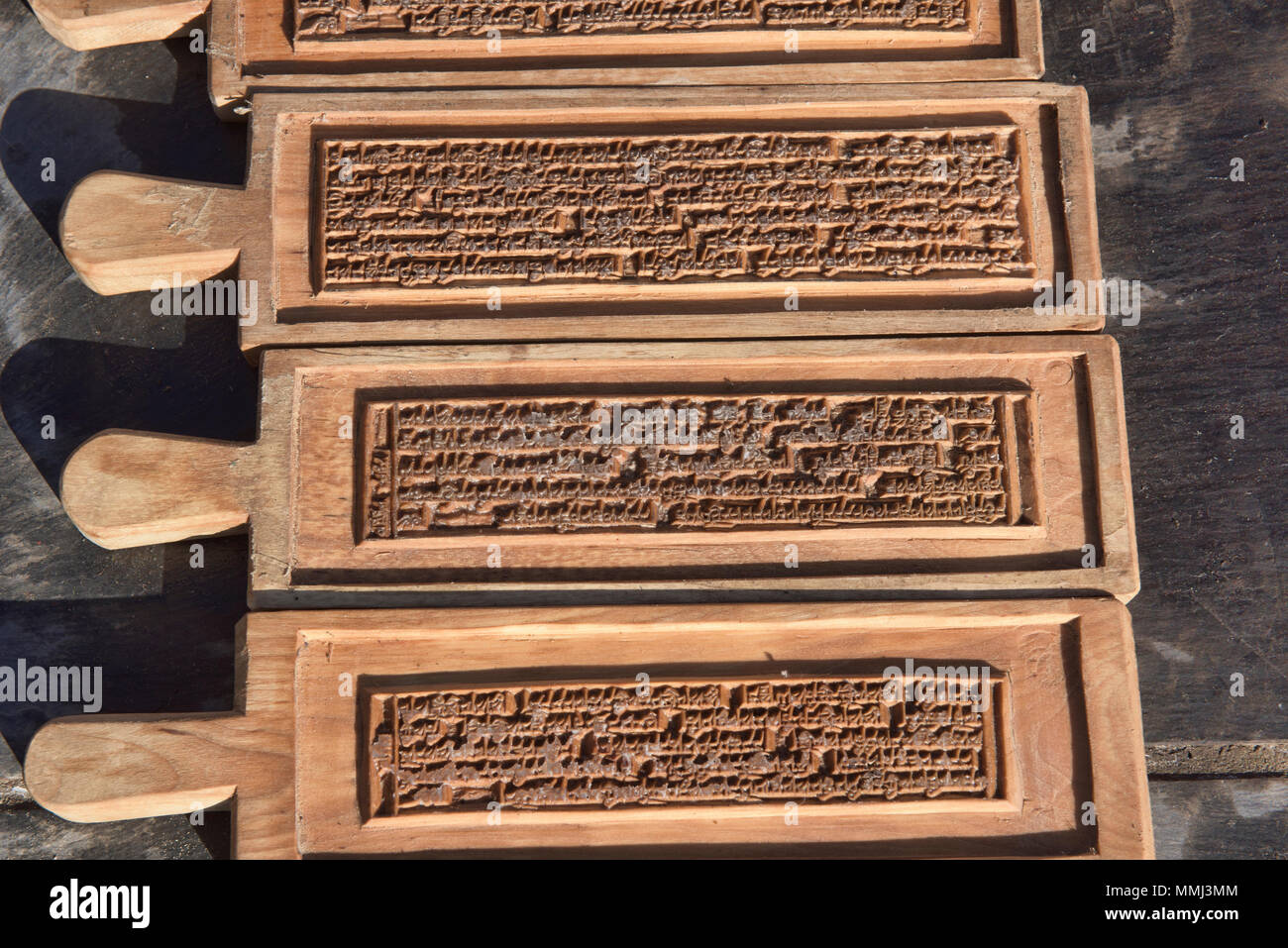 Drying Tibetan woodblock prints at the holy Bakong Scripture Printing ...