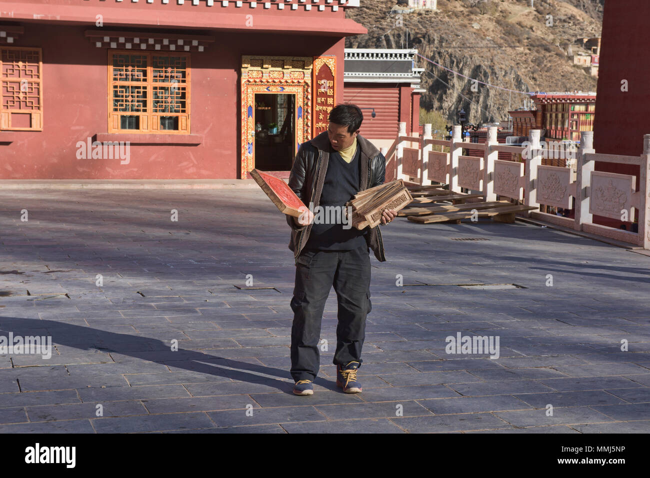Drying Tibetan woodblock prints at the holy Bakong Scripture Printing ...
