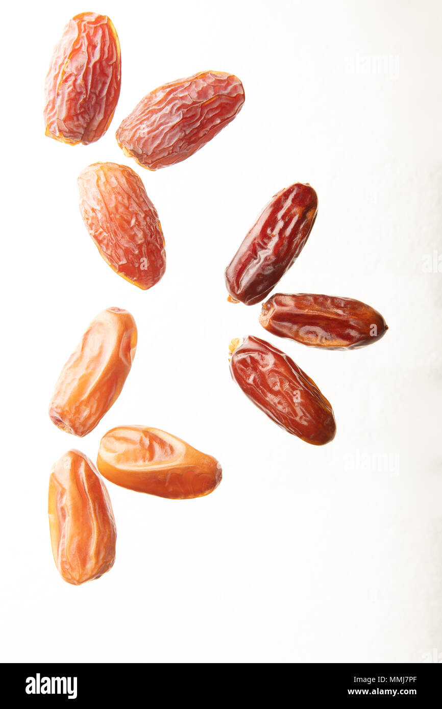 Three different kind of dry dates isolated on white background. Top ...