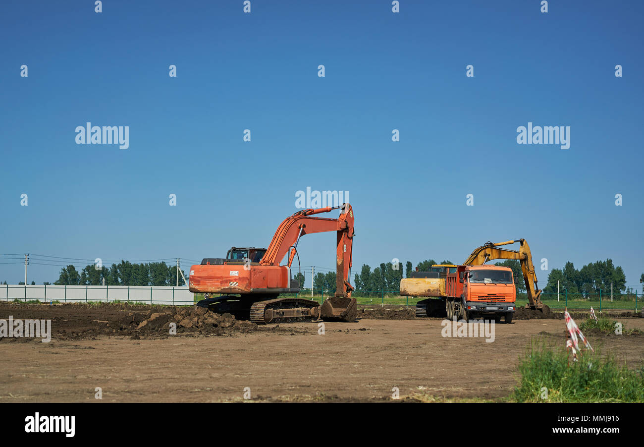 heavy machinery works on the construction site Stock Photo - Alamy