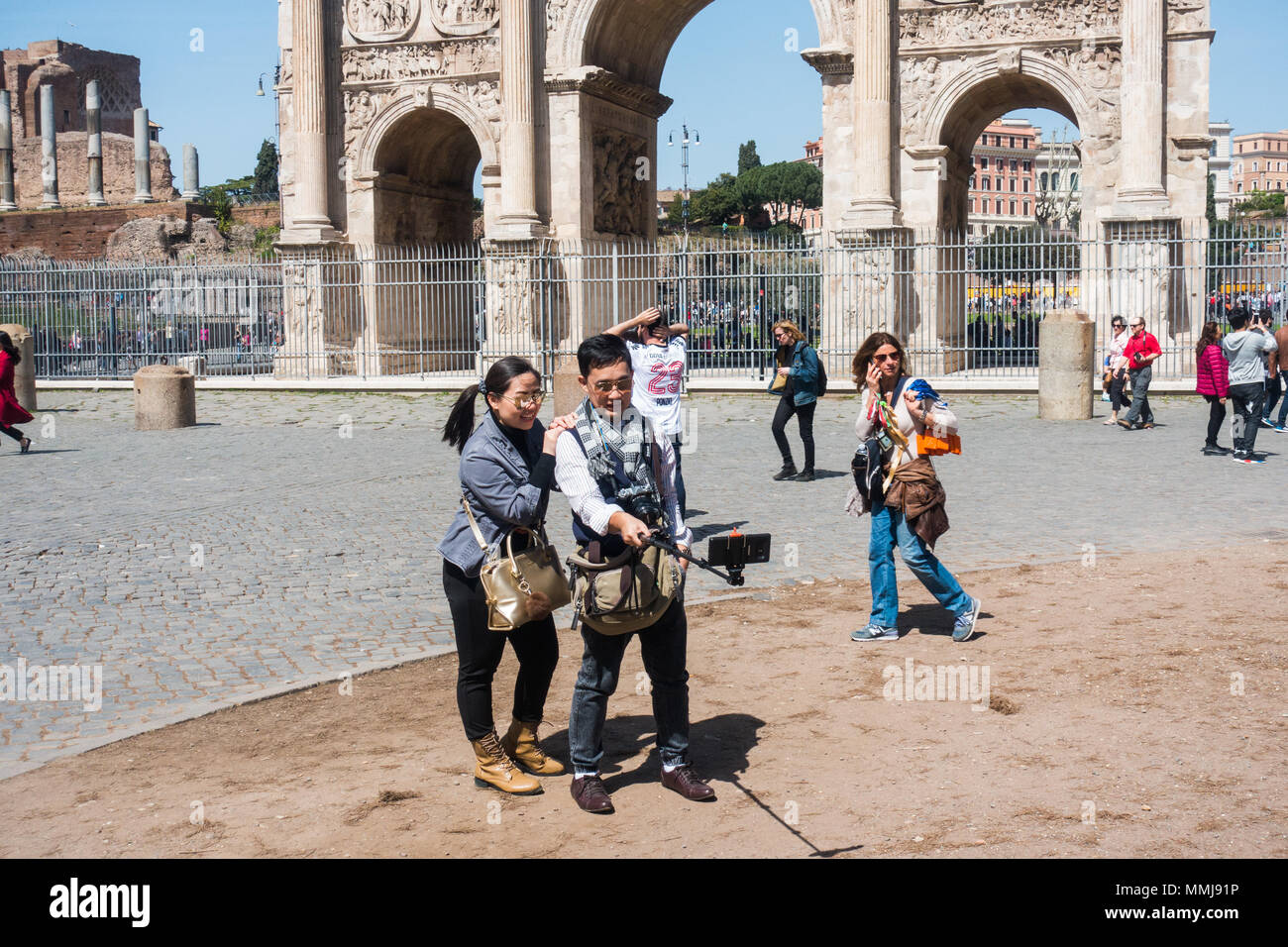 Rome, Italy, 2018 - Tourists next to Colosseum taking selfie Stock ...