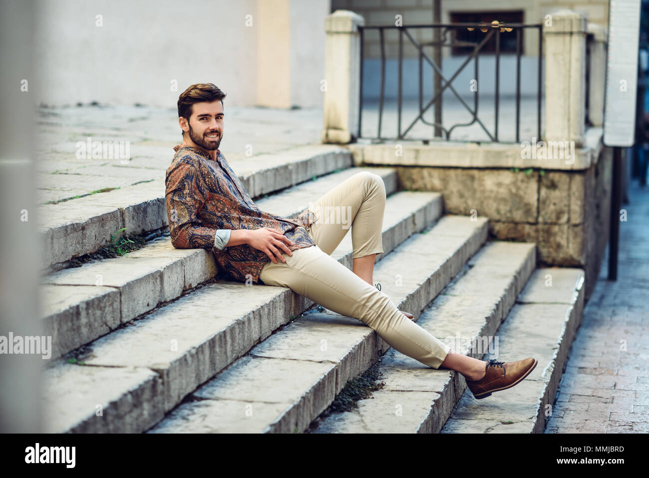 Young smiling man, model of fashion, wearing modern shirt. Guy with ...