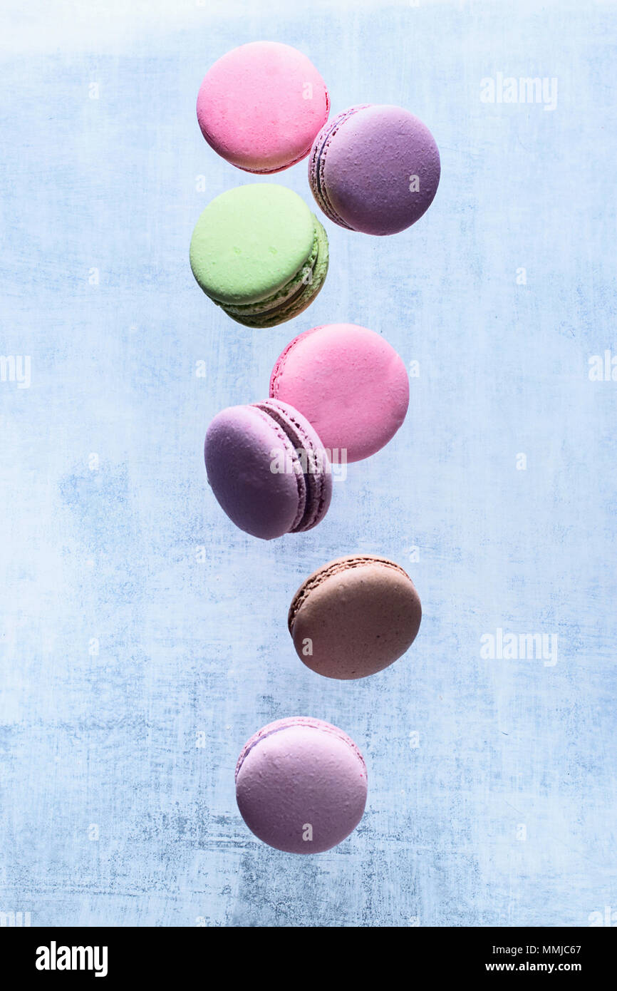 French sweet macaroons flying in motion Stock Photo - Alamy