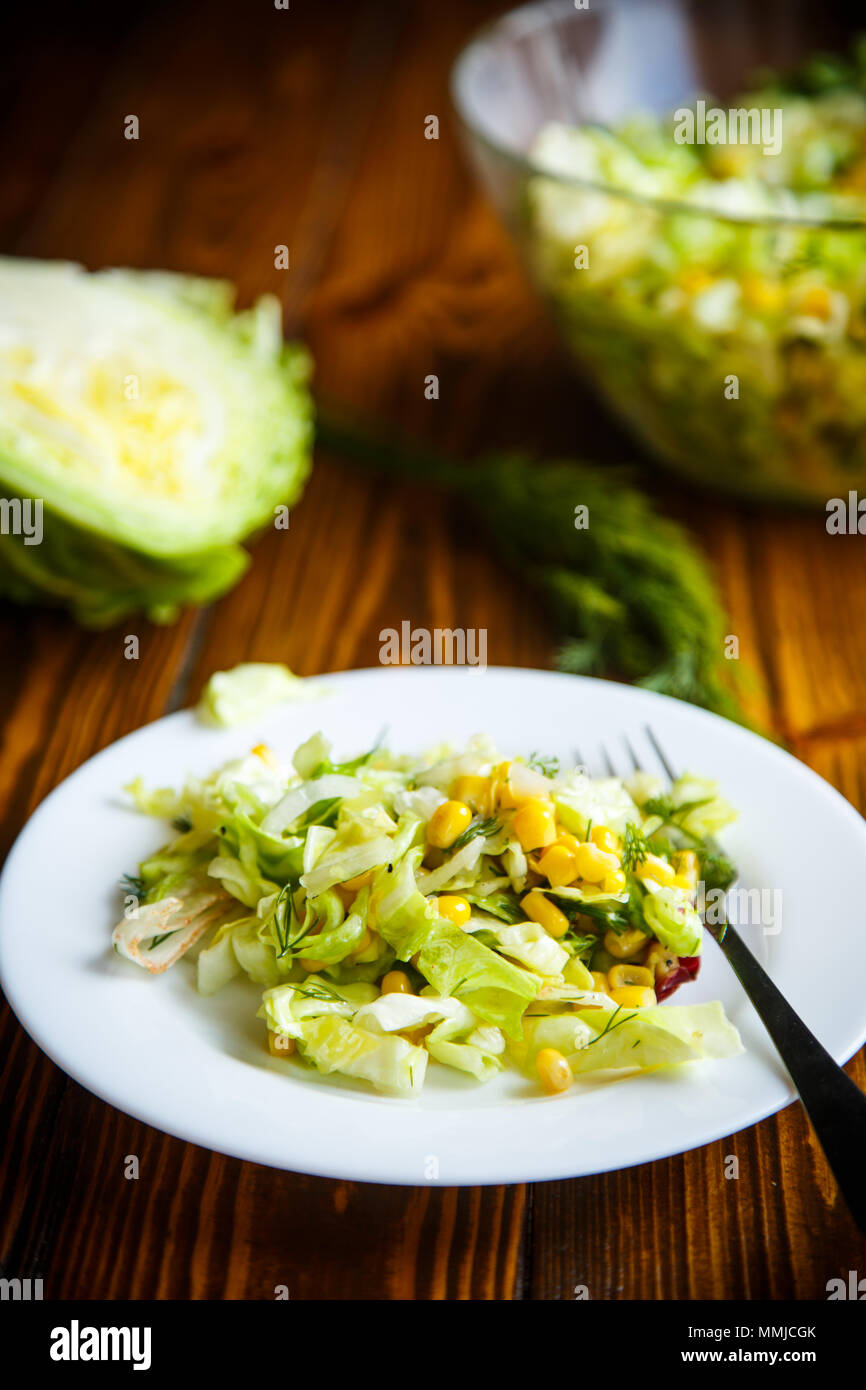 fresh salad of young cabbage with sweet corn Stock Photo - Alamy