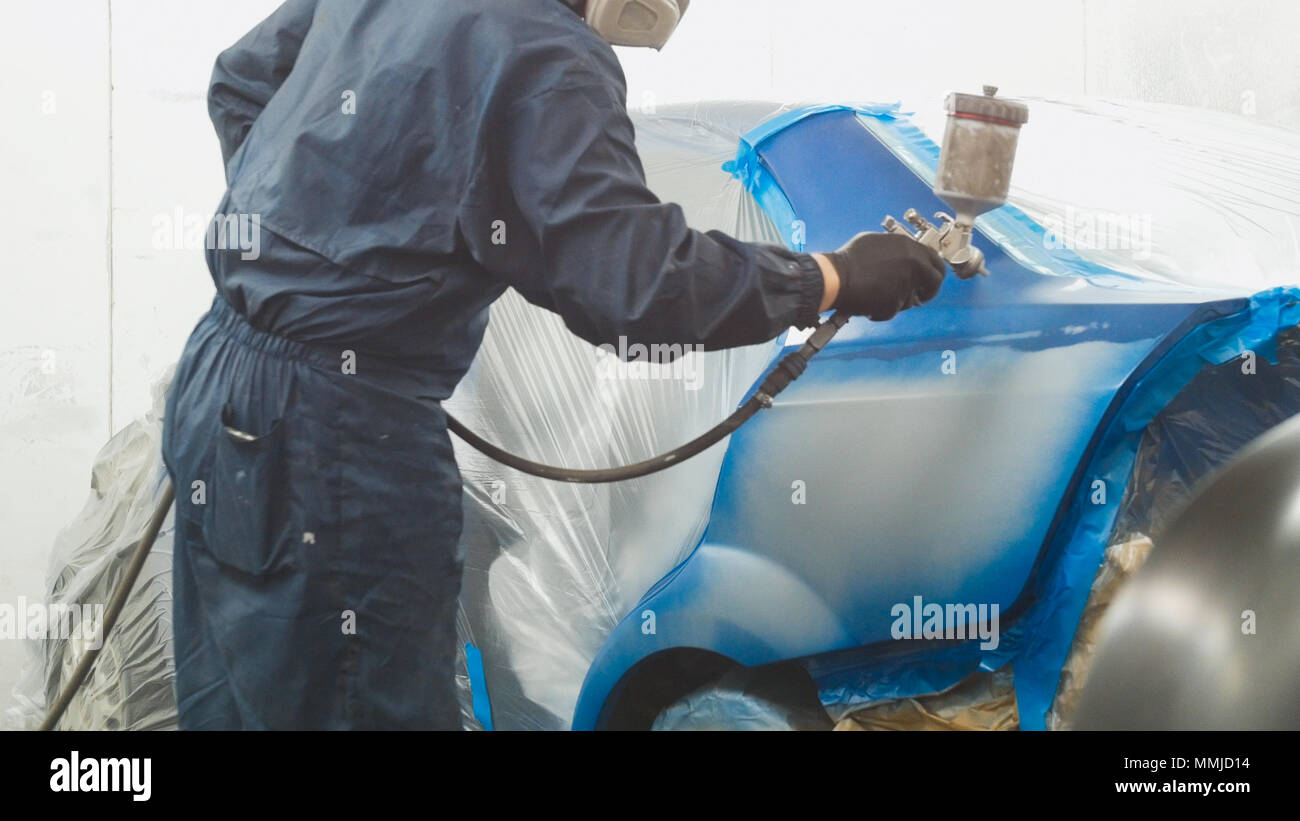 Professional car man painter in vehicle workshop Stock Photo - Alamy