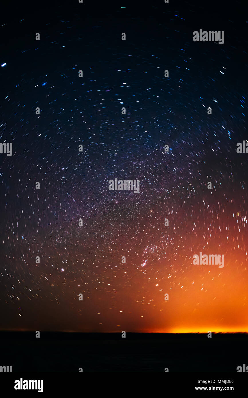 Night Sky Stars Background Texture. Rotation Of Starry Sky. Yellow And ...