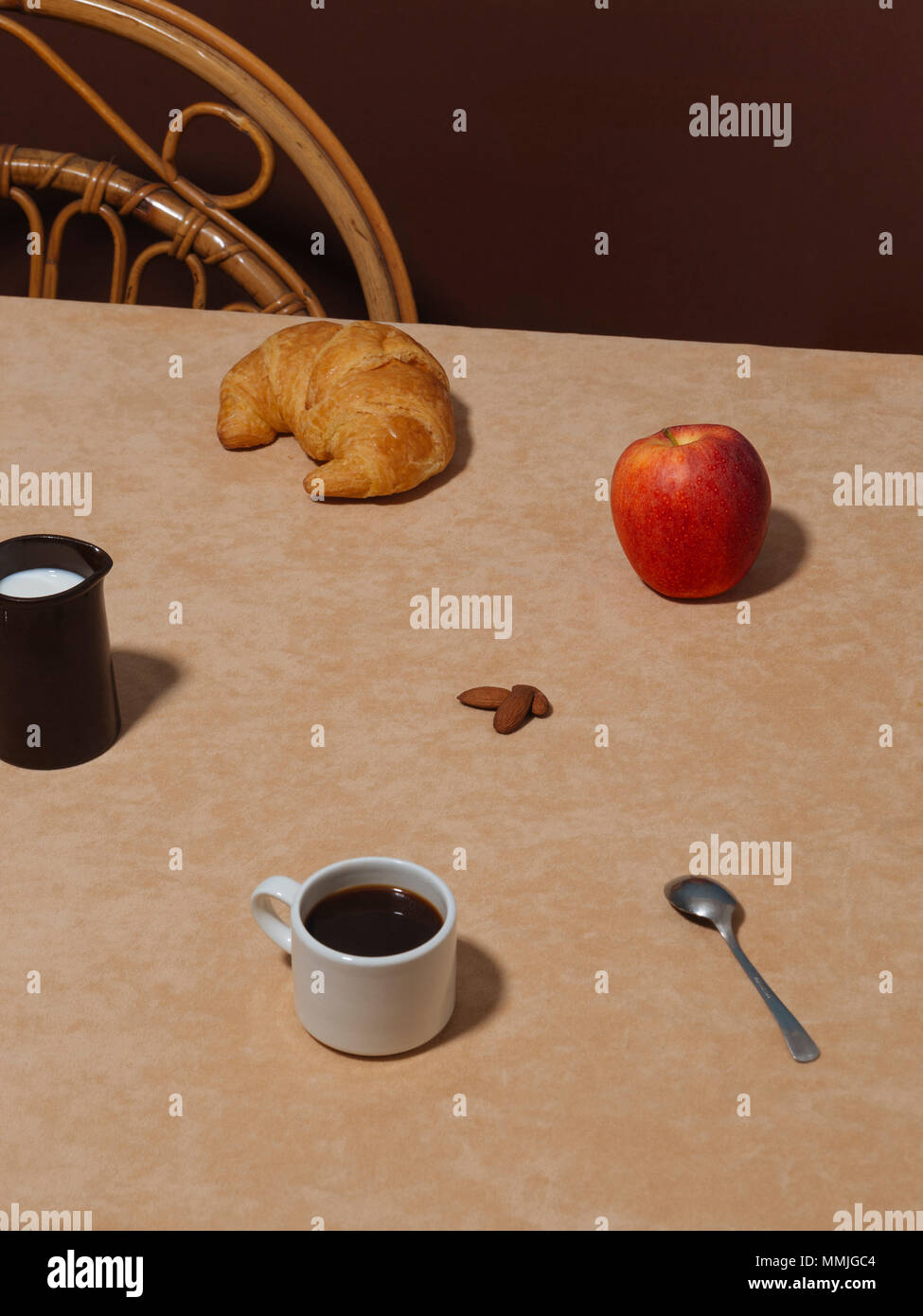 Italian breakfast with espresso coffee, milk, walnut, apple and brioche ...