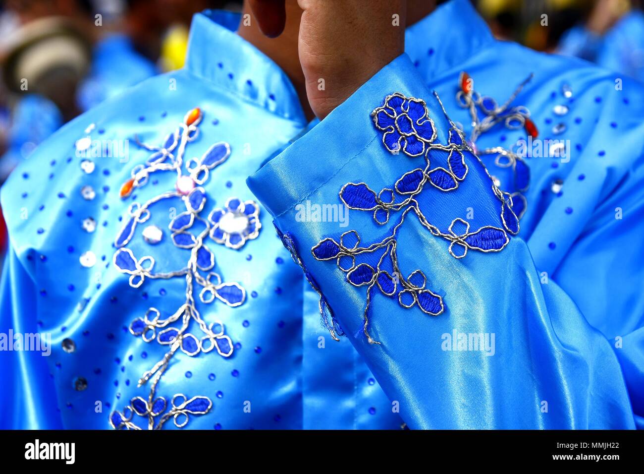 Photo of colorful costumes, attire and props of parade participants ...